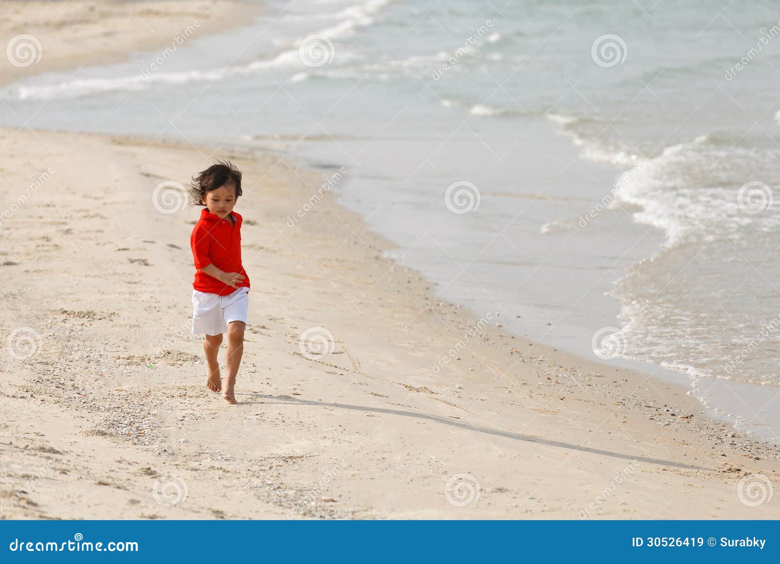 Young boy running on beach stock image. Image of coast - 30526419