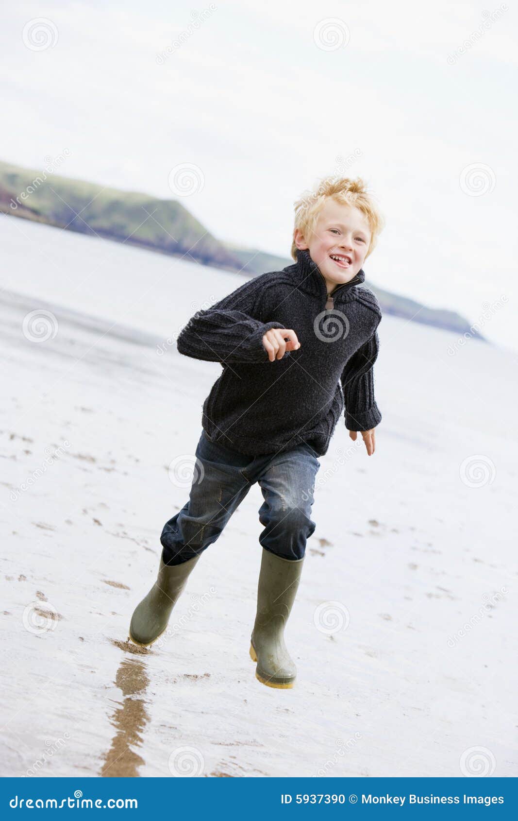 Young Boy Running on Beach Smiling Stock Photo - Image of full ...