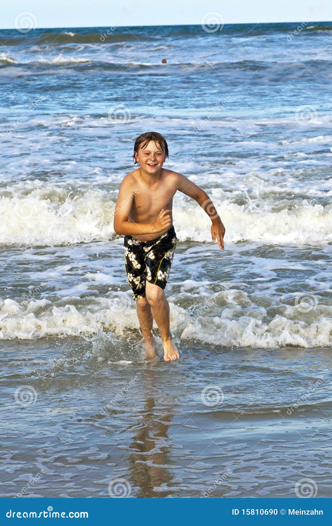 Young Boy Running through the Water at the Beach Stock Photo - Image of ...