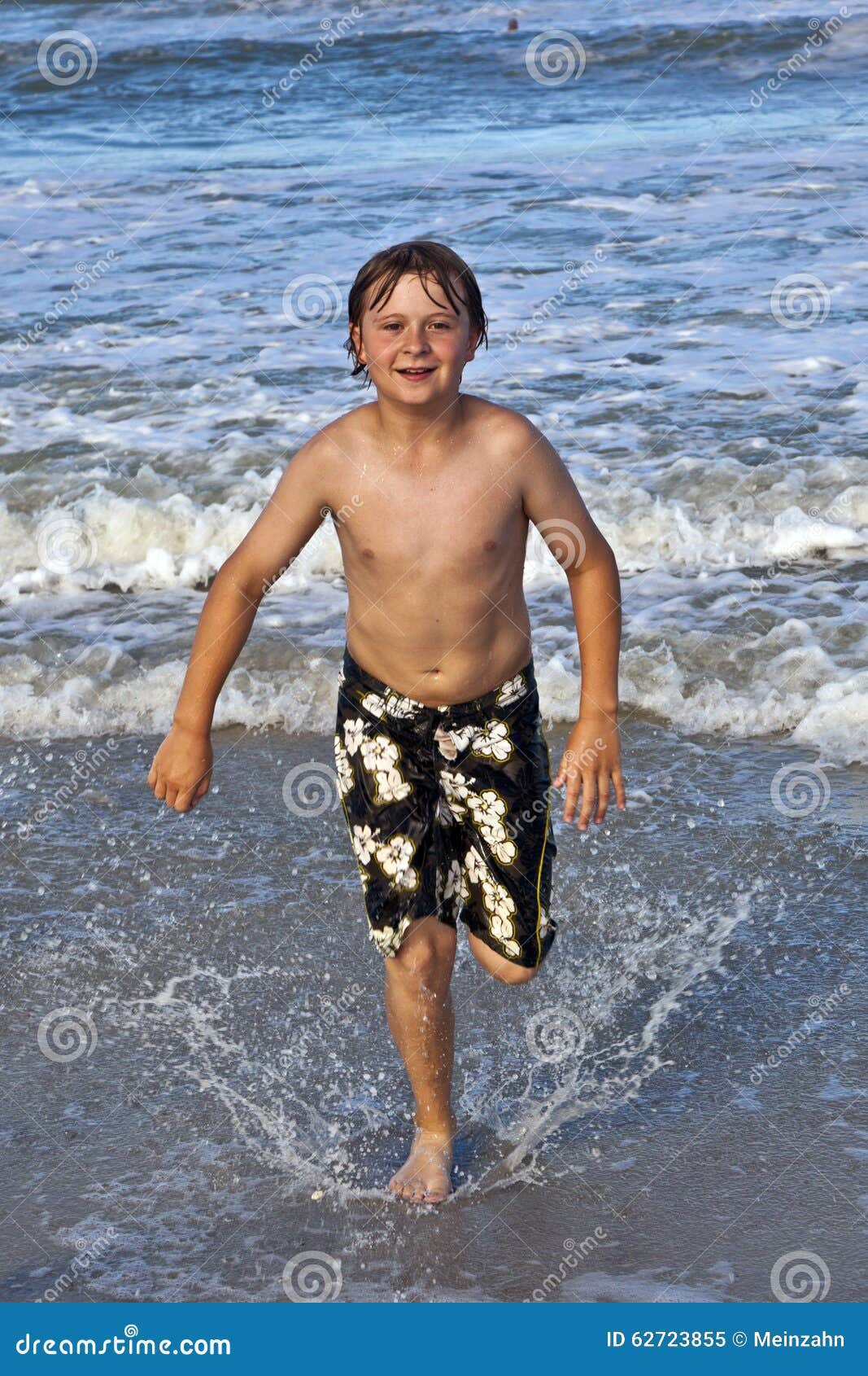 Young Boy Running through the Water at the Beach Stock Image - Image of ...
