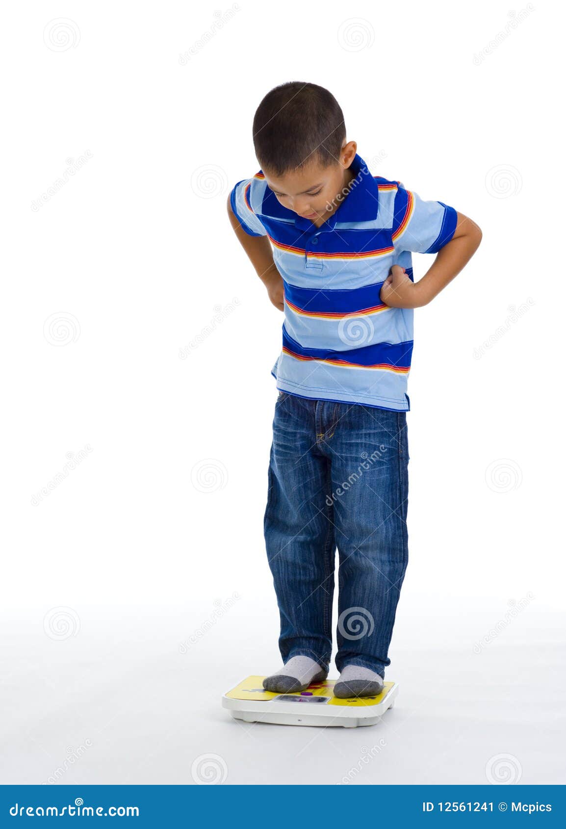 Young boy on scale stock image. Image of male, looking - 12561241