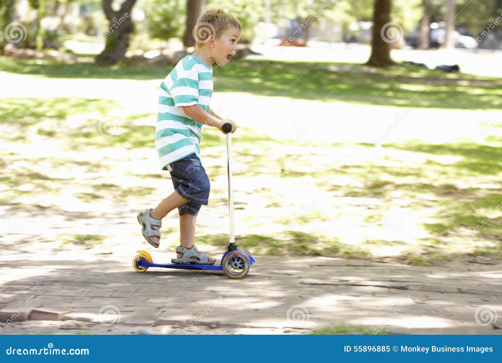 Young Boy on Scooter in Park Stock Image - Image of active, energy ...