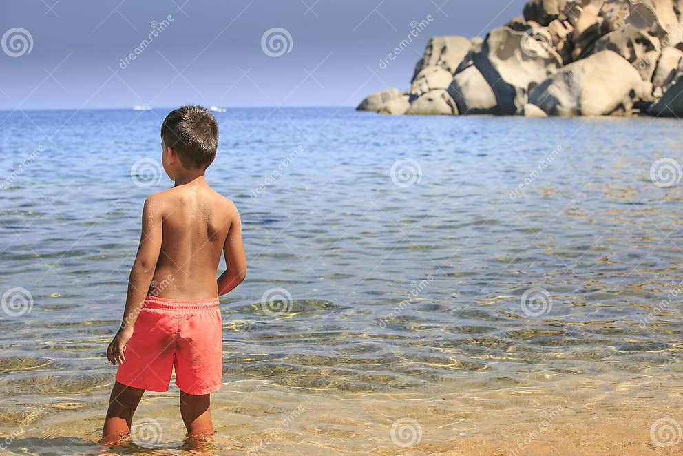 Young boy seeing the sea stock photo. Image of issues - 97198704