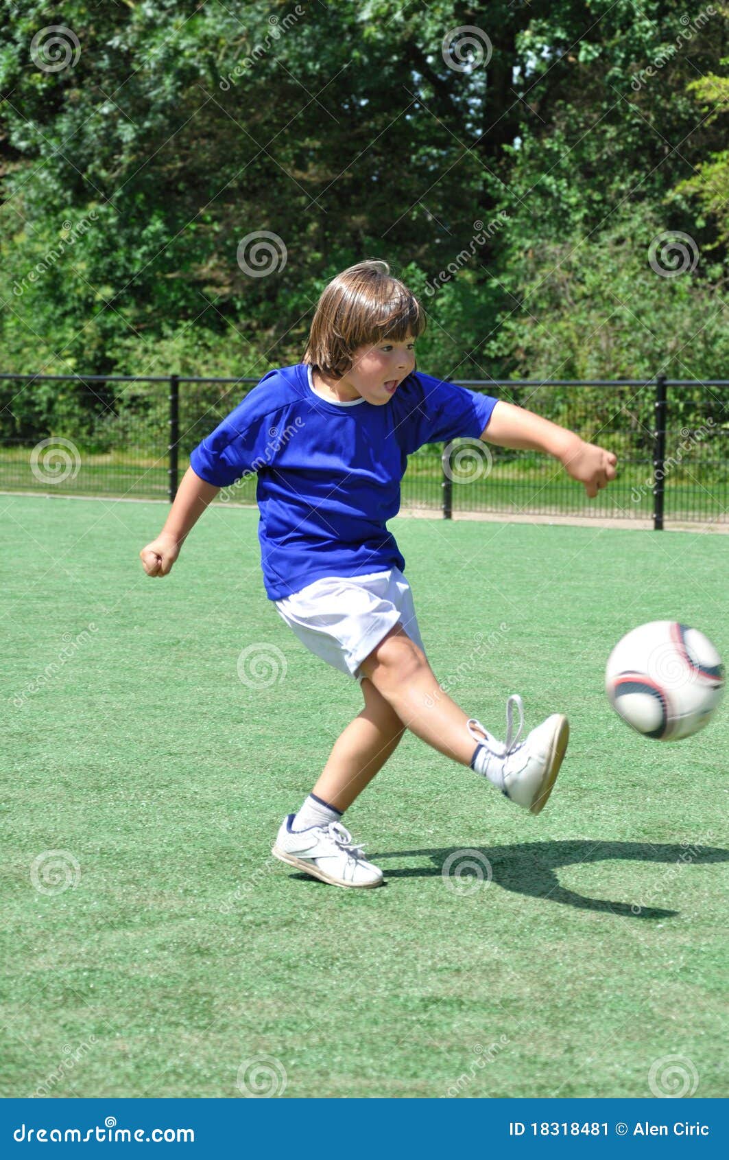 Young boy shooting ball stock image. Image of action - 18318481