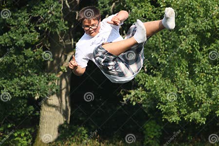 Young Boy, with Shorts, and Shirt Falling Down, from High Tree Stock ...