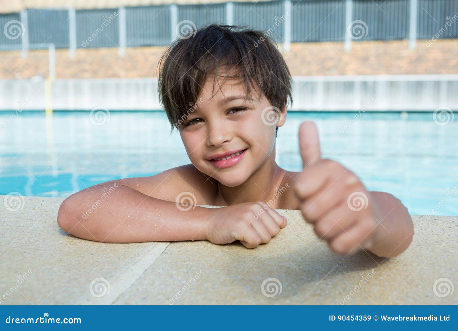 Young Boy Showing Thumbs Up at Poolside Stock Image - Image of ...