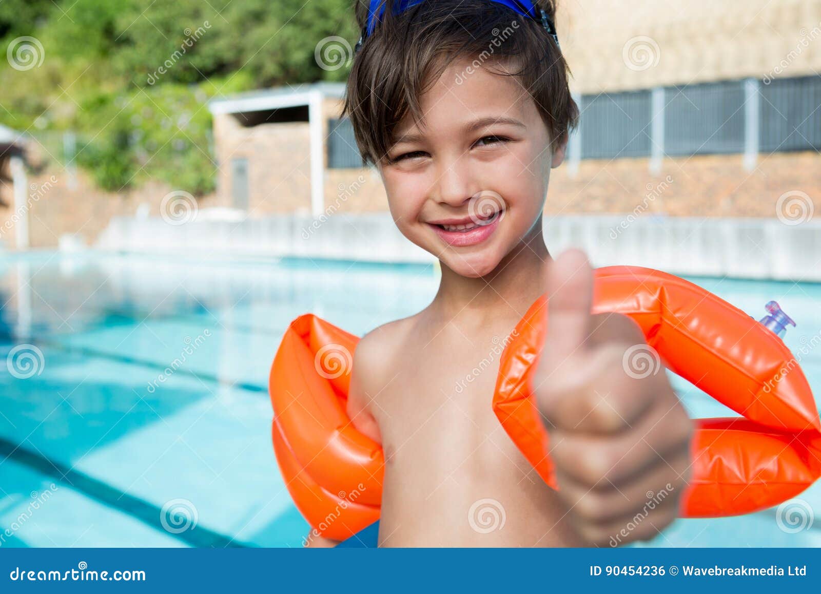 Young Boy Showing Thumbs Up at Poolside Stock Photo - Image of male ...