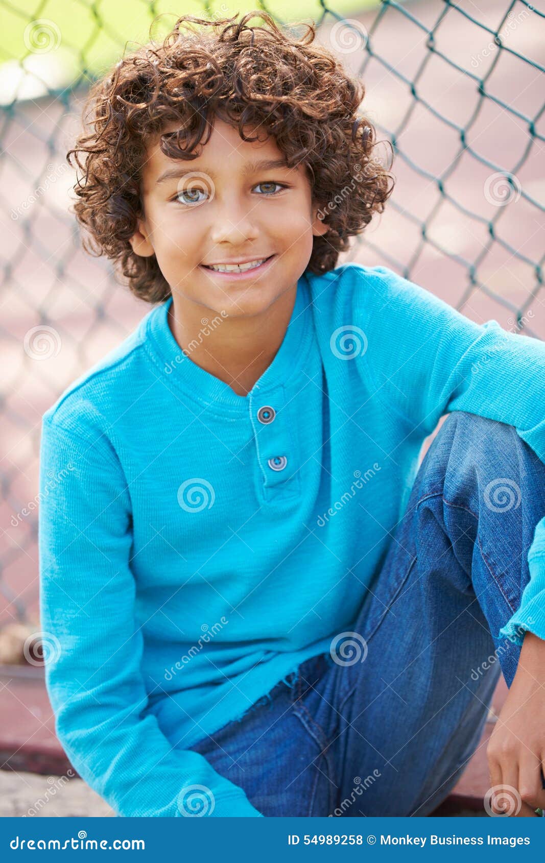 Young Boy Sitting on Bench in Park Stock Photo - Image of person, bench ...