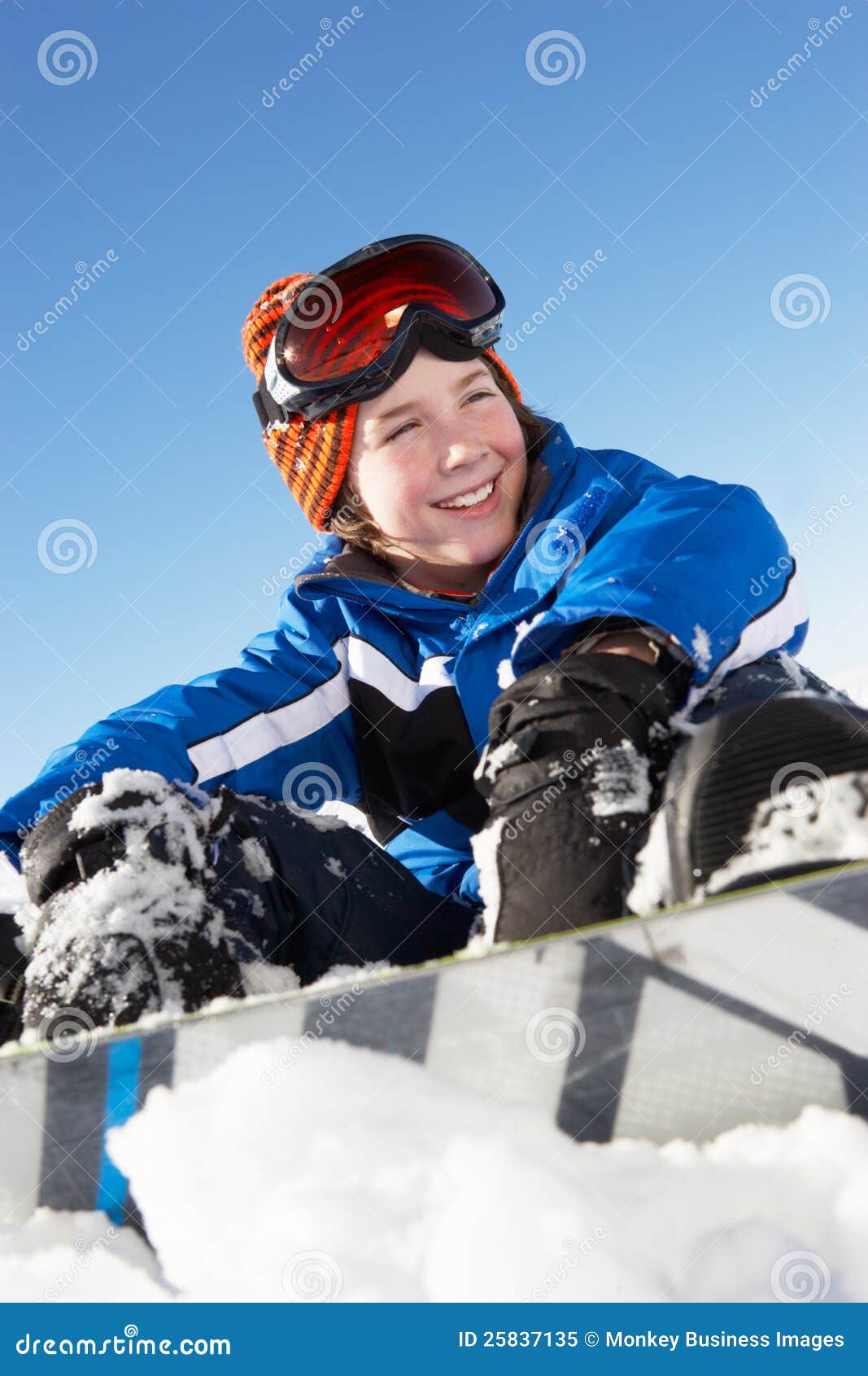 Young Boy Sitting in Snow with Snowboard Stock Image - Image of ...