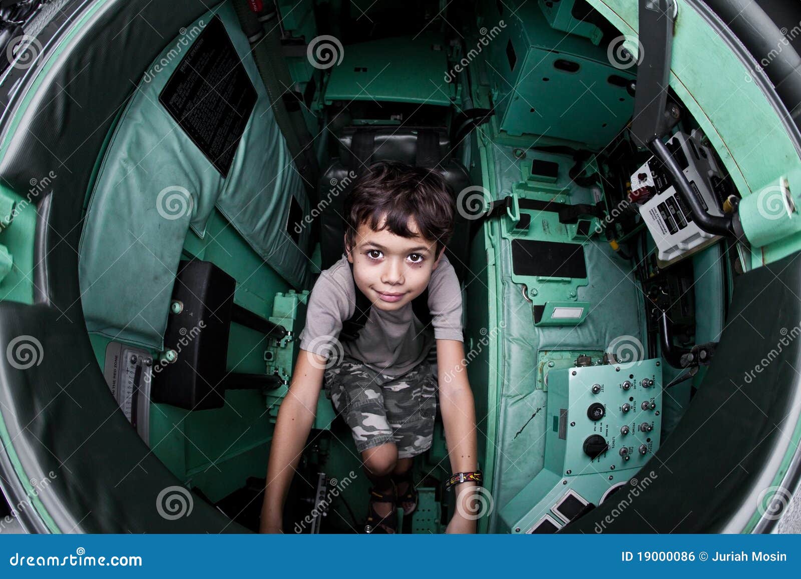 Young Boy Sitting in a Tank Stock Photo - Image of dream, space: 19000086