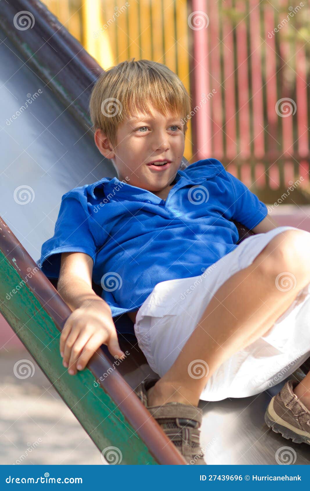 Young Boy on a Slide in the Park Stock Photo - Image of sliding ...