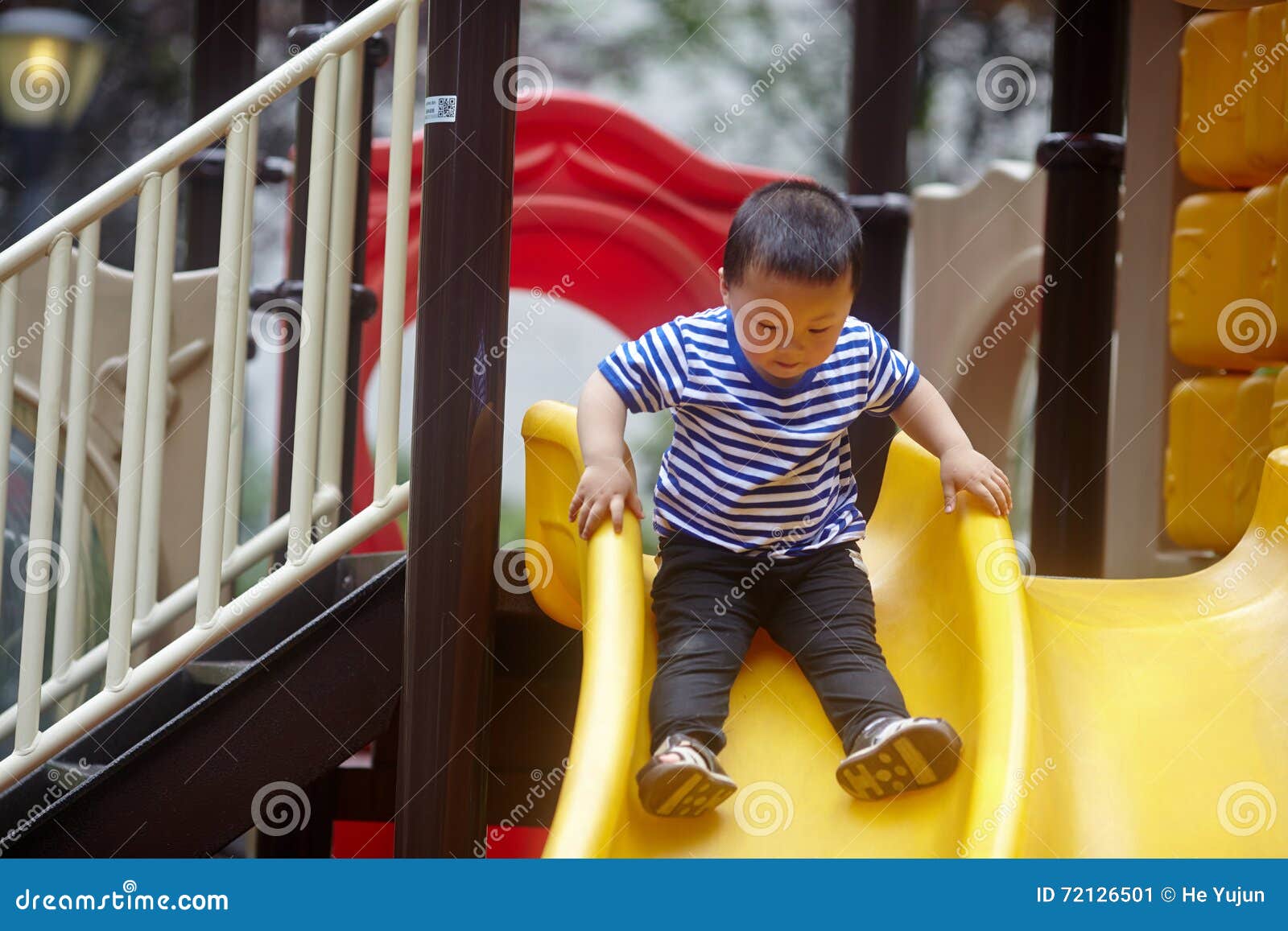 Young boy on slide stock image. Image of playing, ground - 72126501