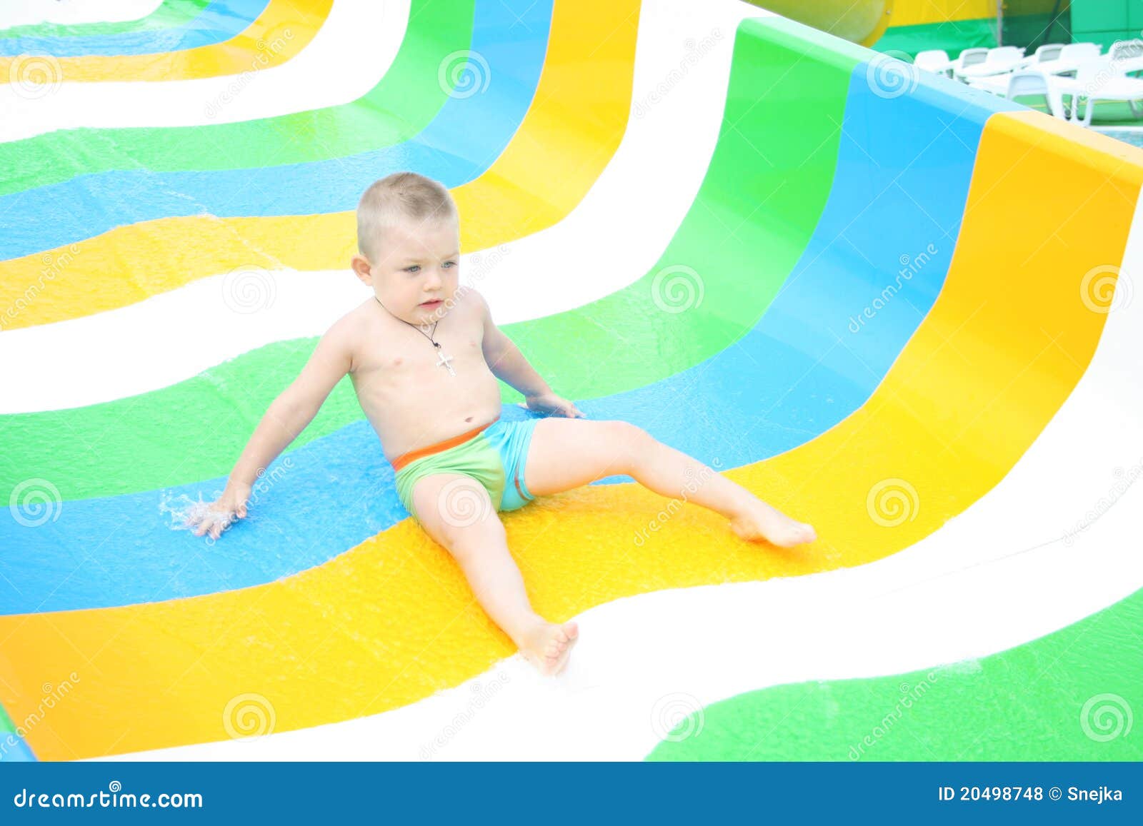 Young boy sliding stock photo. Image of vacation, young - 20498748