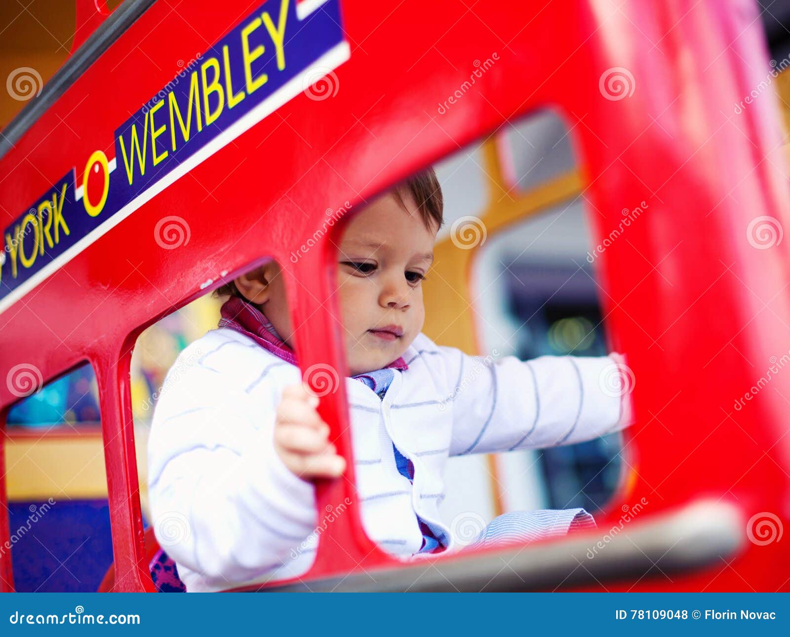 Young Boy Smiling Having Fun in Toy Bus Stock Photo - Image of child ...