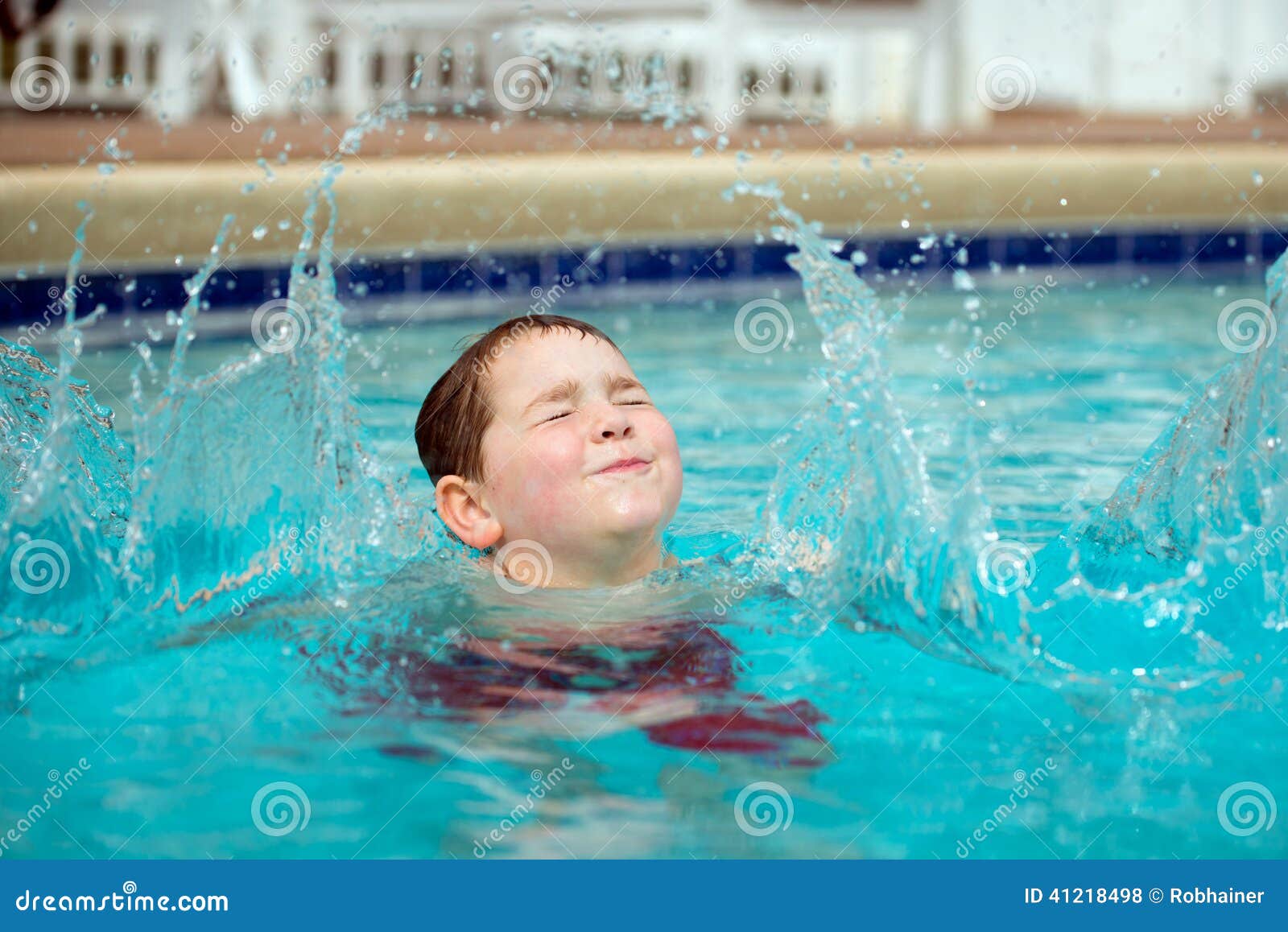 Young Boy Splashing into Pool Stock Photo - Image of happiness, healthy ...