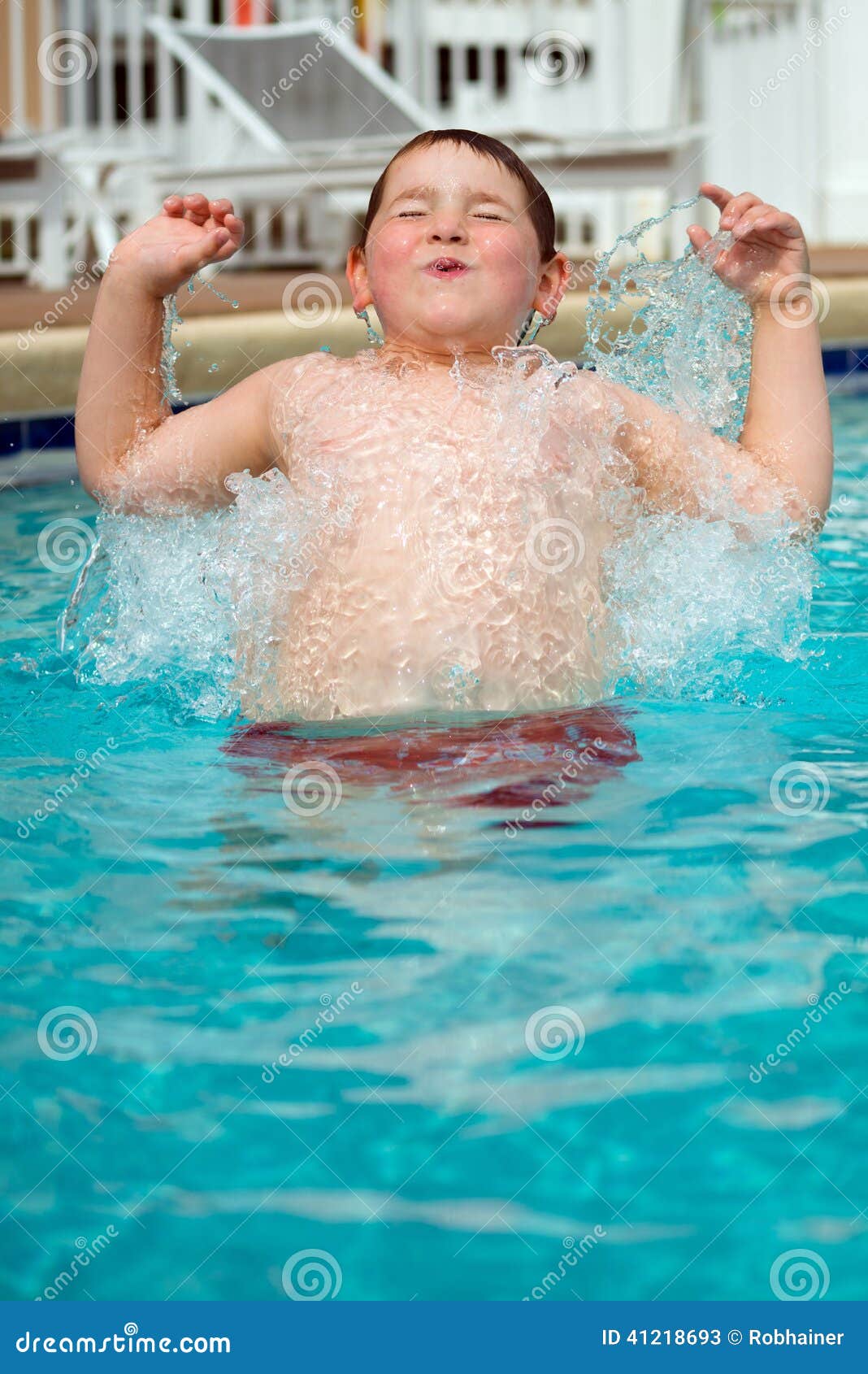 Young Boy Splashing into Pool Stock Image - Image of cute, energetic ...