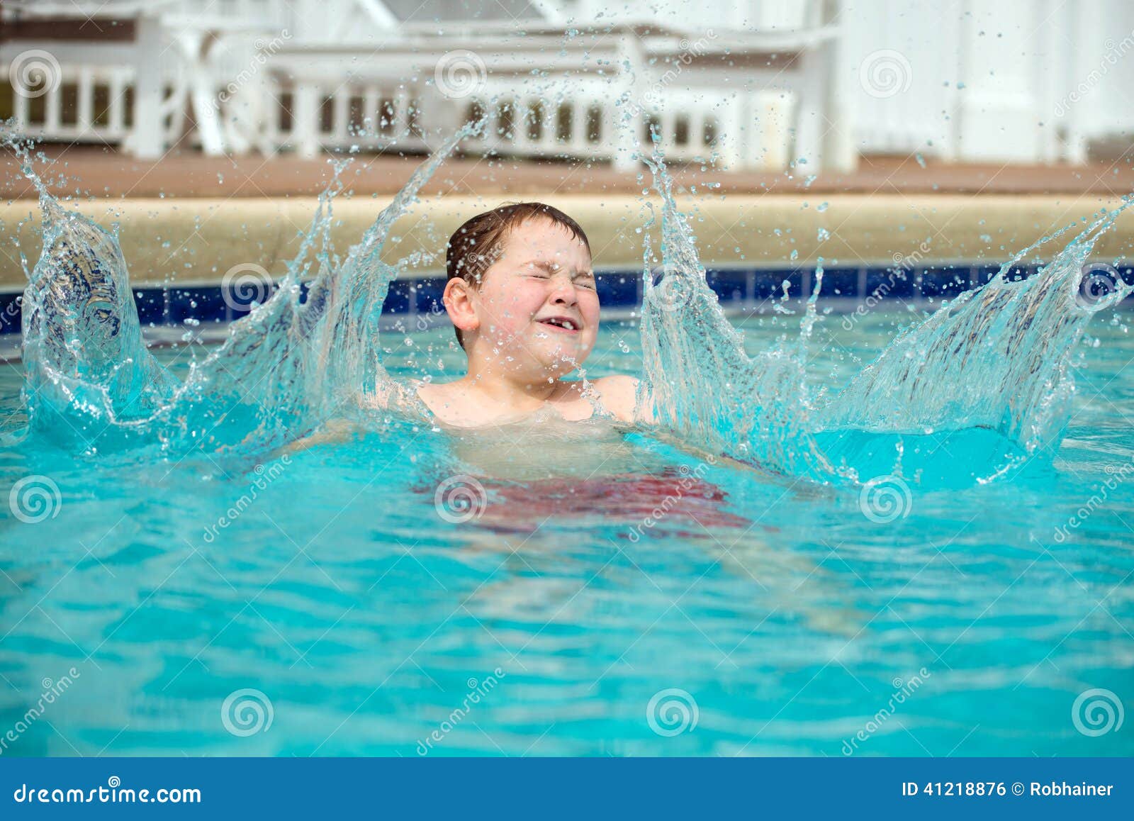 Young Boy Splashing into Pool Stock Photo - Image of pool, happiness ...