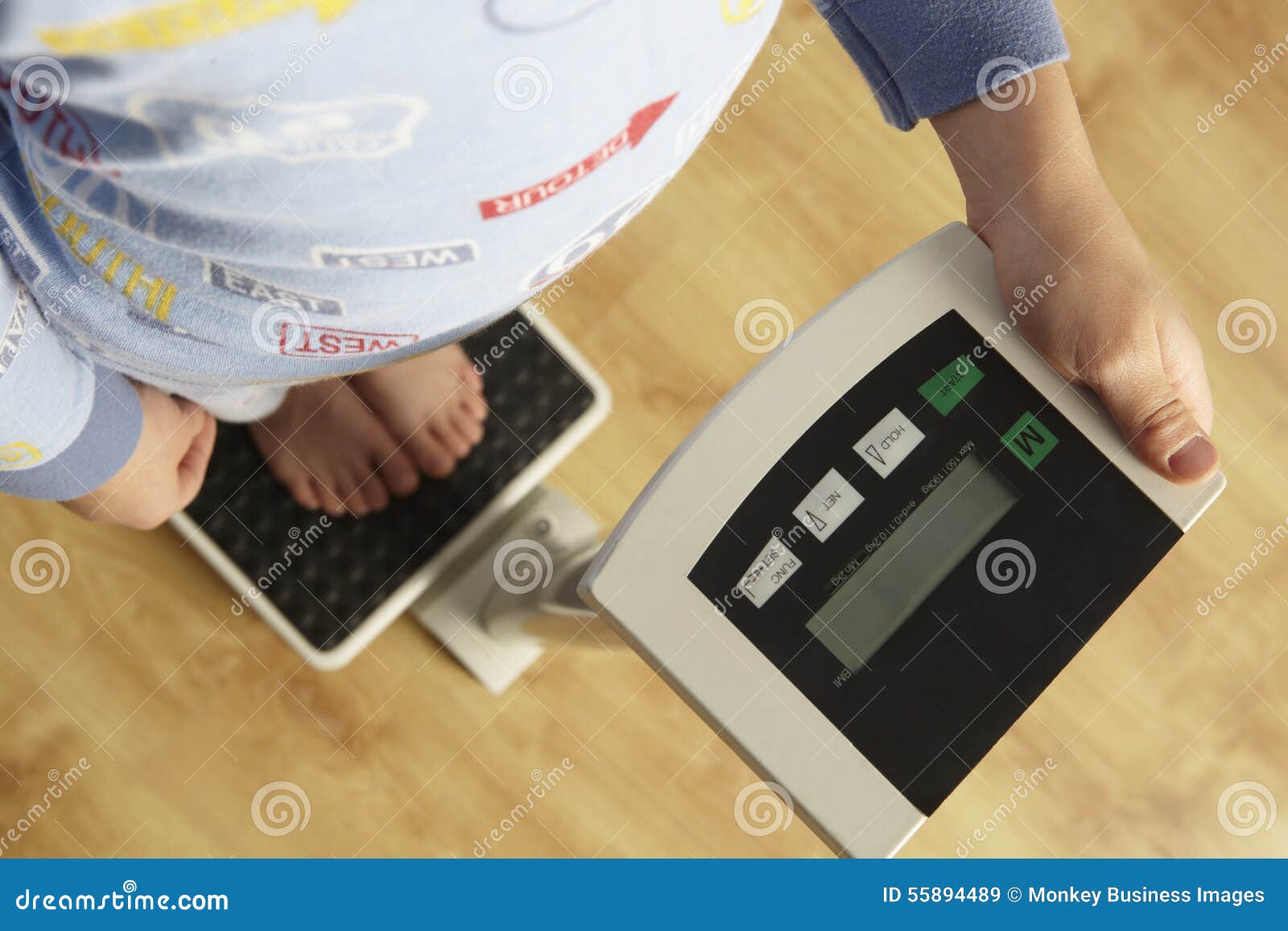 Young Boy Standing on Digital Scales Cropped Waist Down Stock Image ...