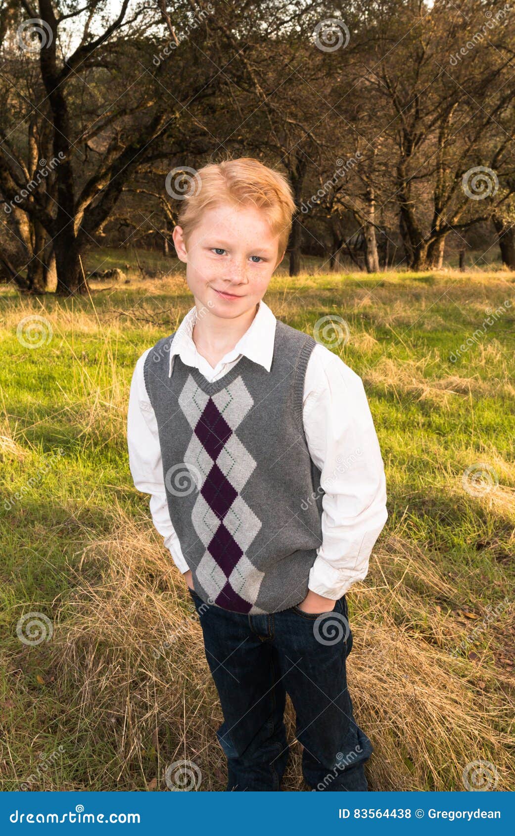 Young Boy Standing in Green Field Stock Photo - Image of child ...