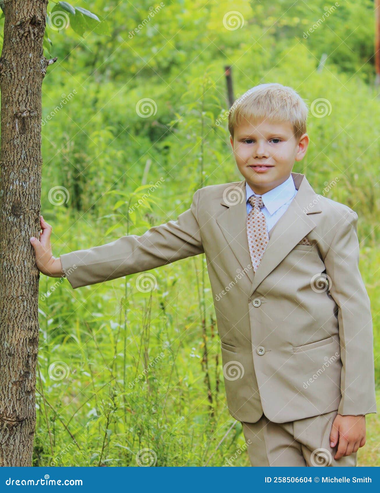 Young Child Dressed in Tan Suit Stock Photo - Image of businessman ...