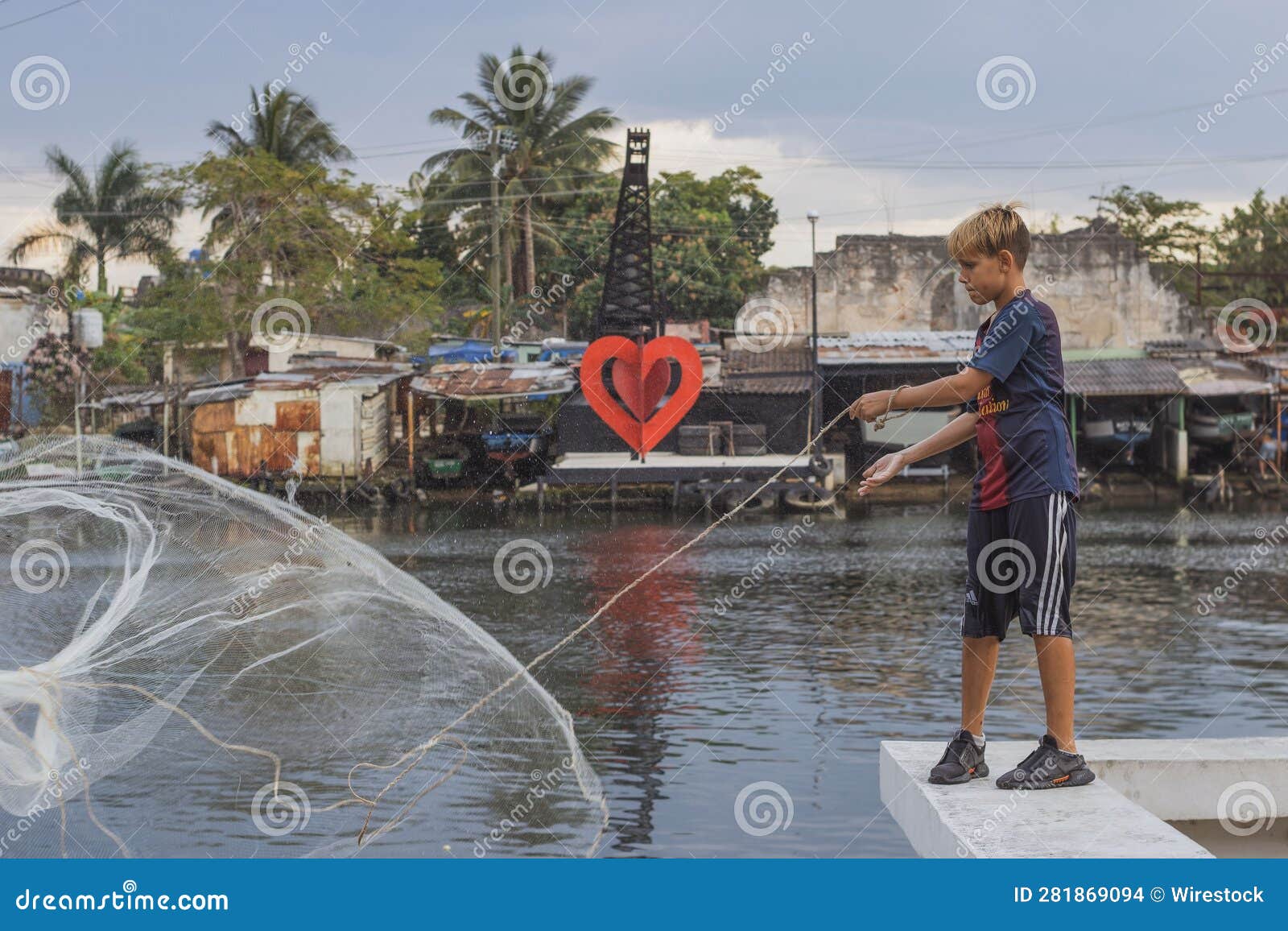 Young Boy Stands by a River, Holding a Net Editorial Stock Image ...