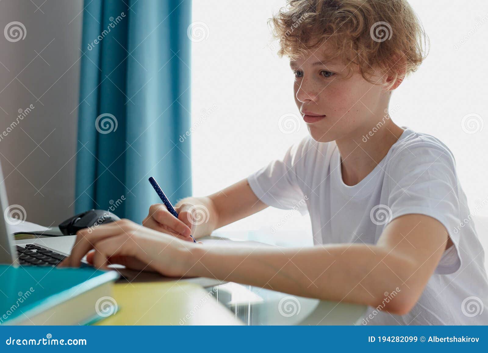 Young boy studying at home stock image. Image of cheerful - 194282099