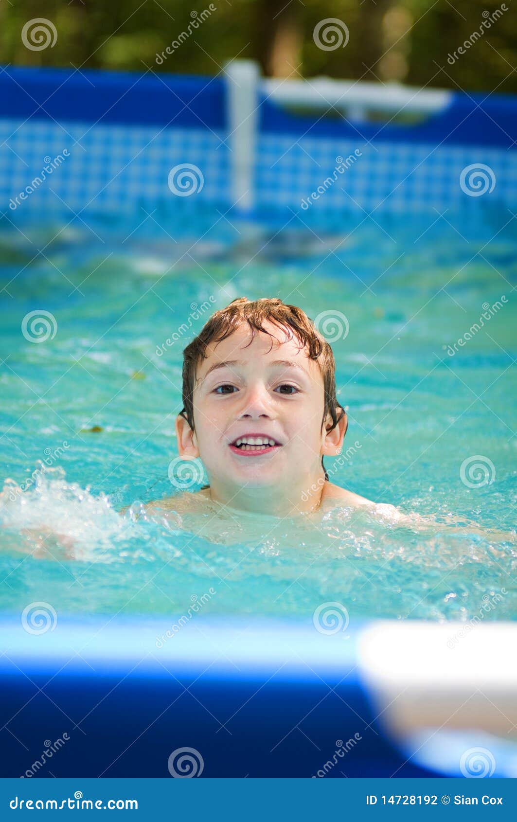 Young Boy Swimming in an Outdoor Pool Stock Photo - Image of face ...