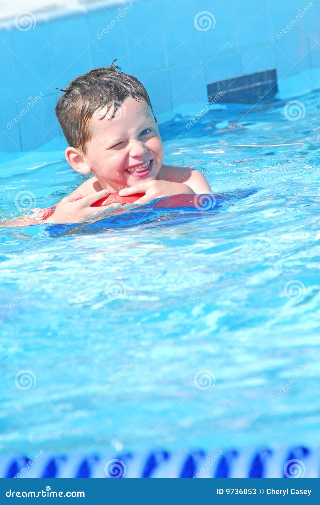 Young boy in swimming pool stock image. Image of winking - 9736053