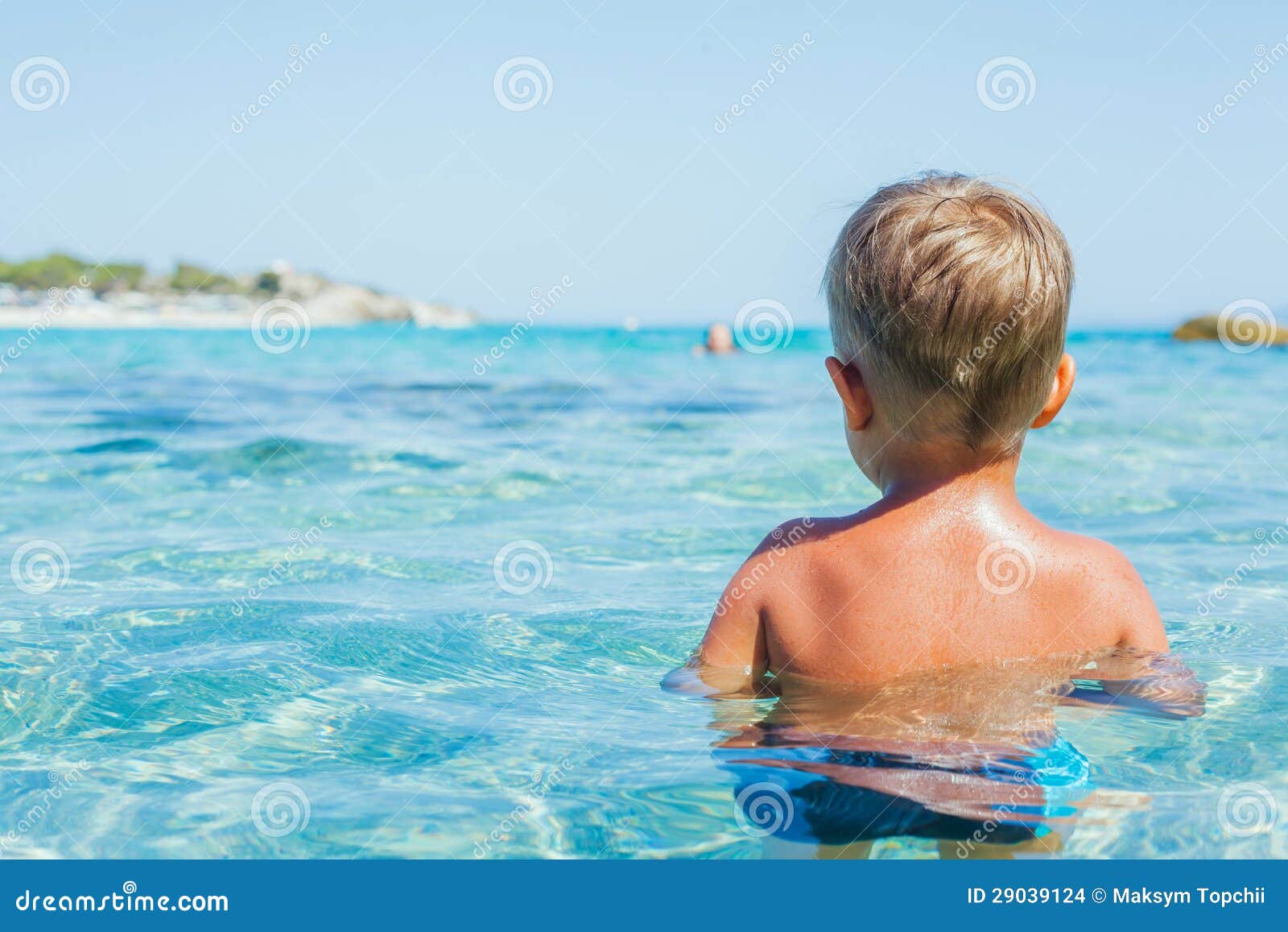 Young boy swimming in sea stock photo. Image of beach - 29039124