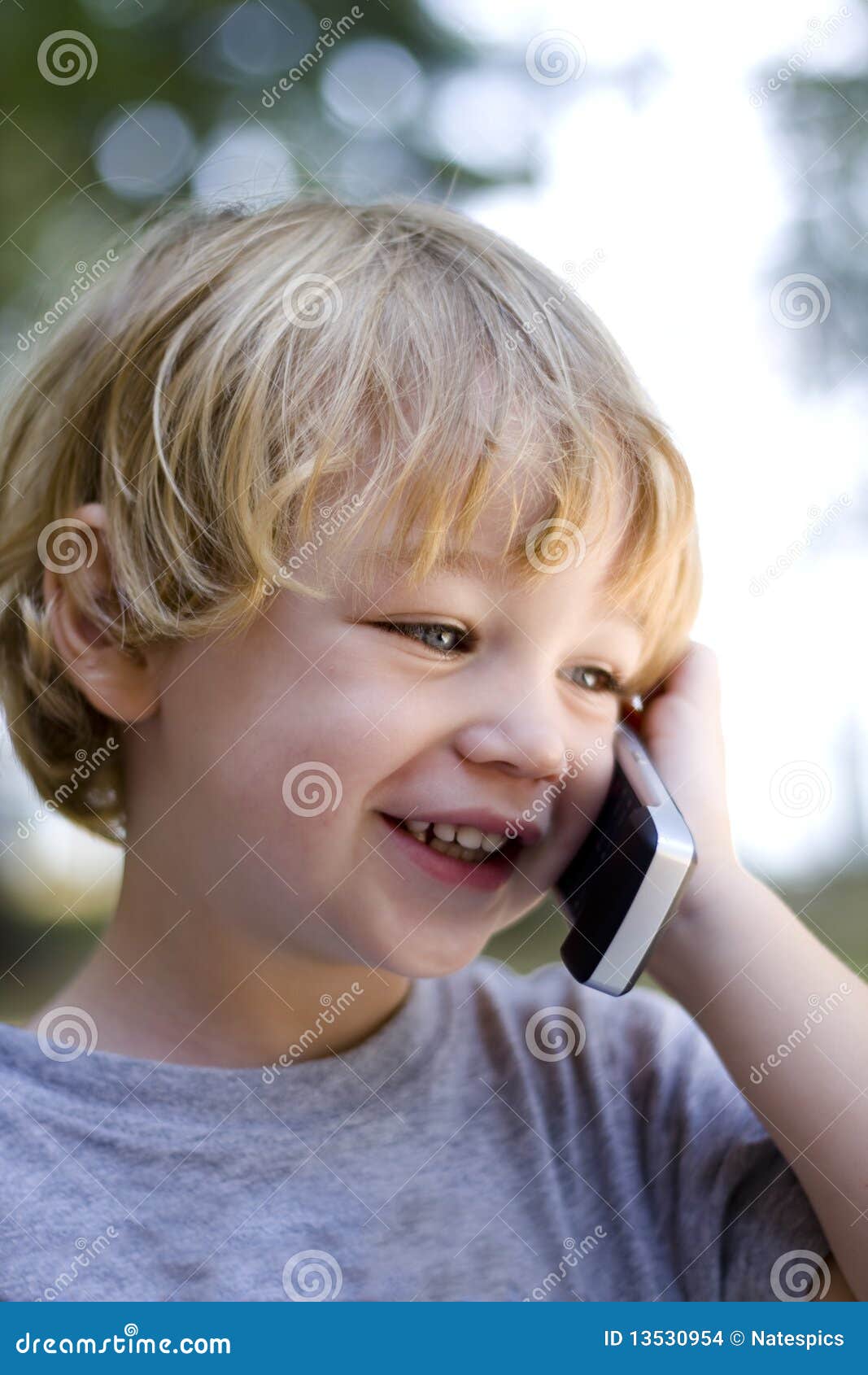 Young Boy Talking on Cell Phone Stock Photo - Image of blue, keeping ...
