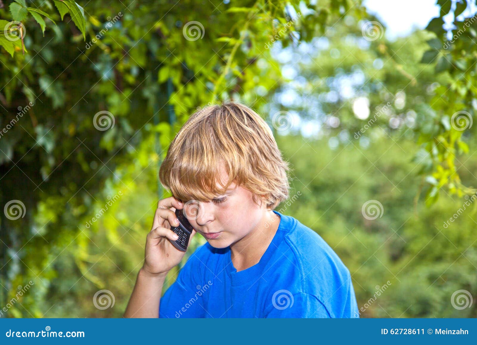 Young Boy Talking on a Cell Phone. Stock Image - Image of cellular ...