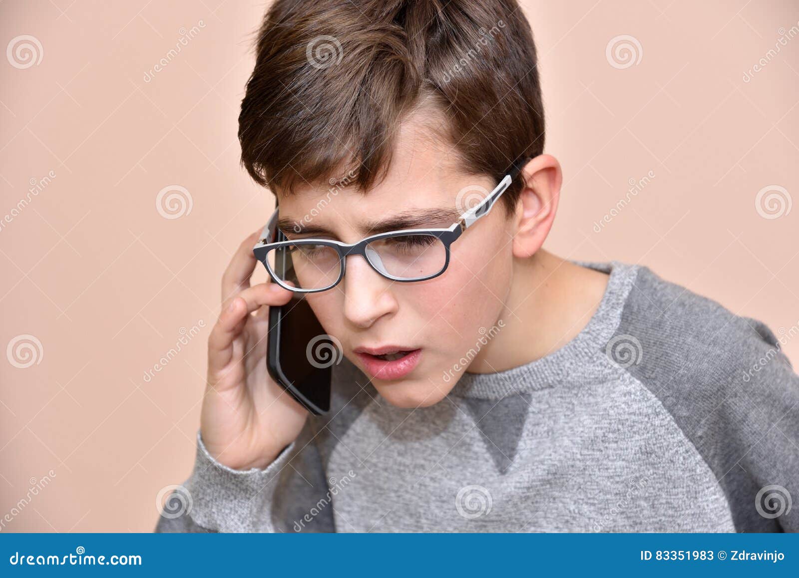 Young Boy Talking on His Smart Phone Stock Image - Image of holding ...