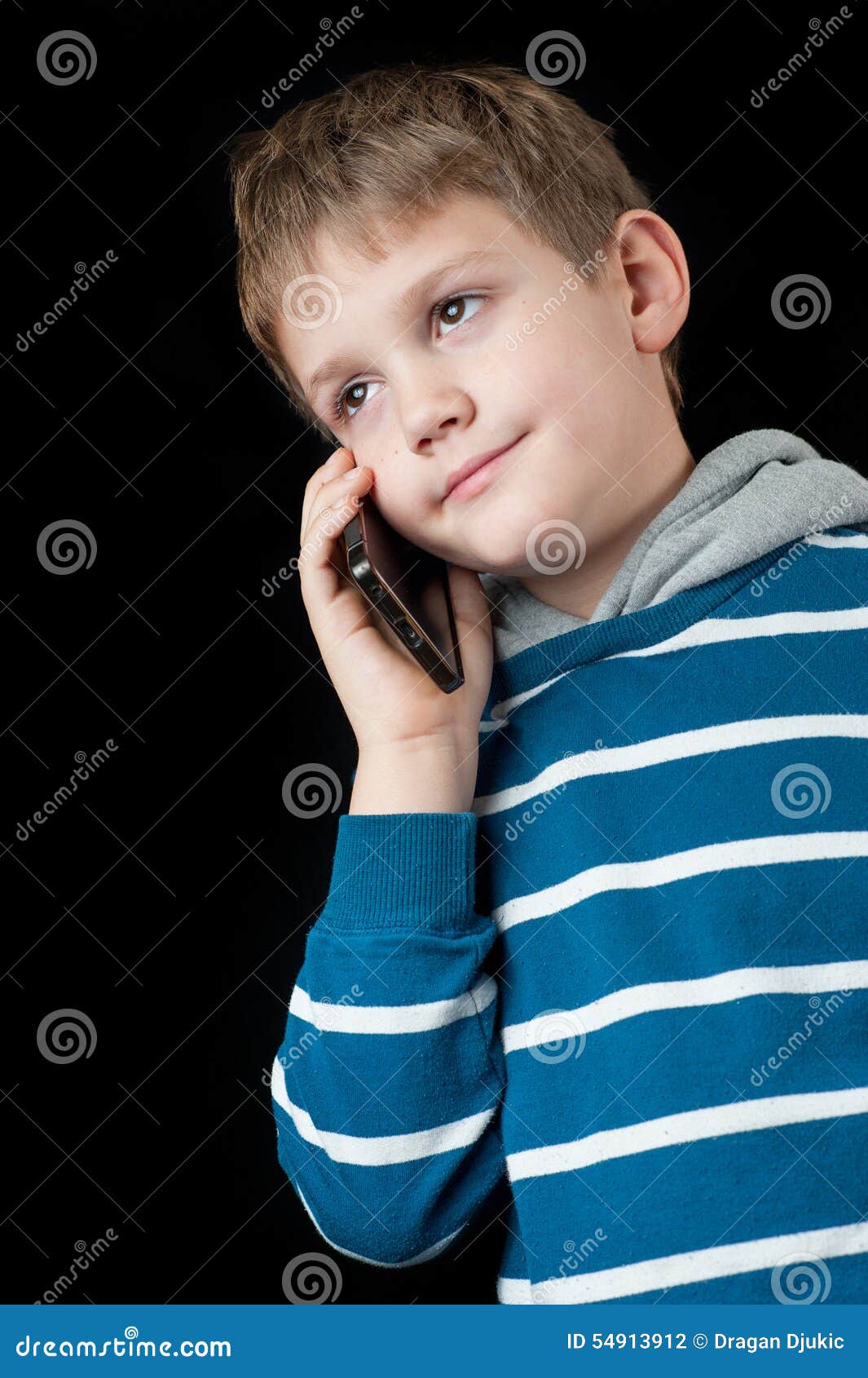 Young Boy Talking on Mobile Phone and Smiling Stock Photo - Image of ...