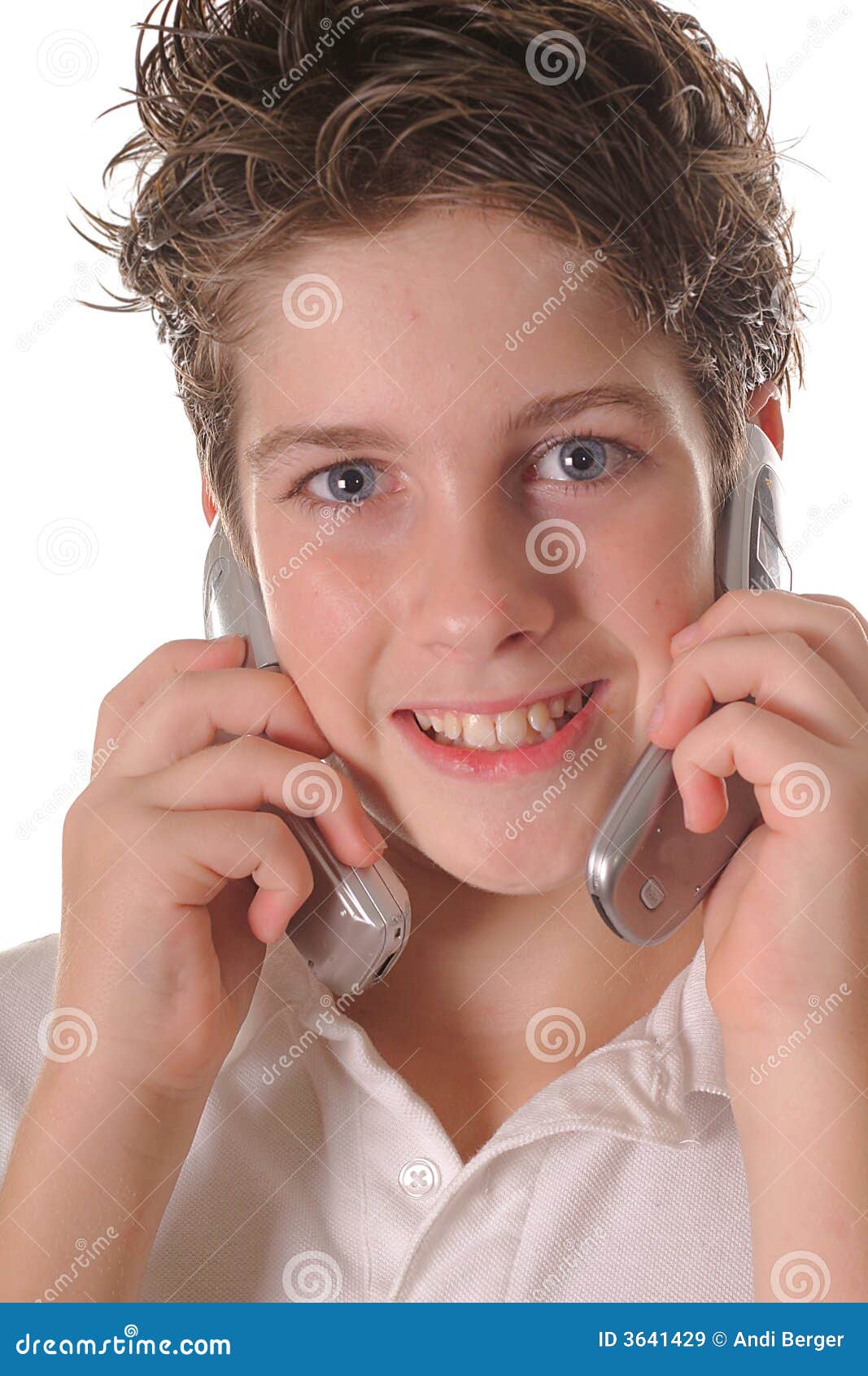 Young Boy Talking on Two Cell Phones Upclose Verti Stock Image - Image ...