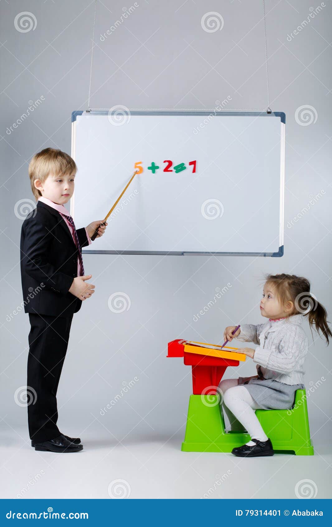Young boy teaching sister stock image. Image of class - 79314401