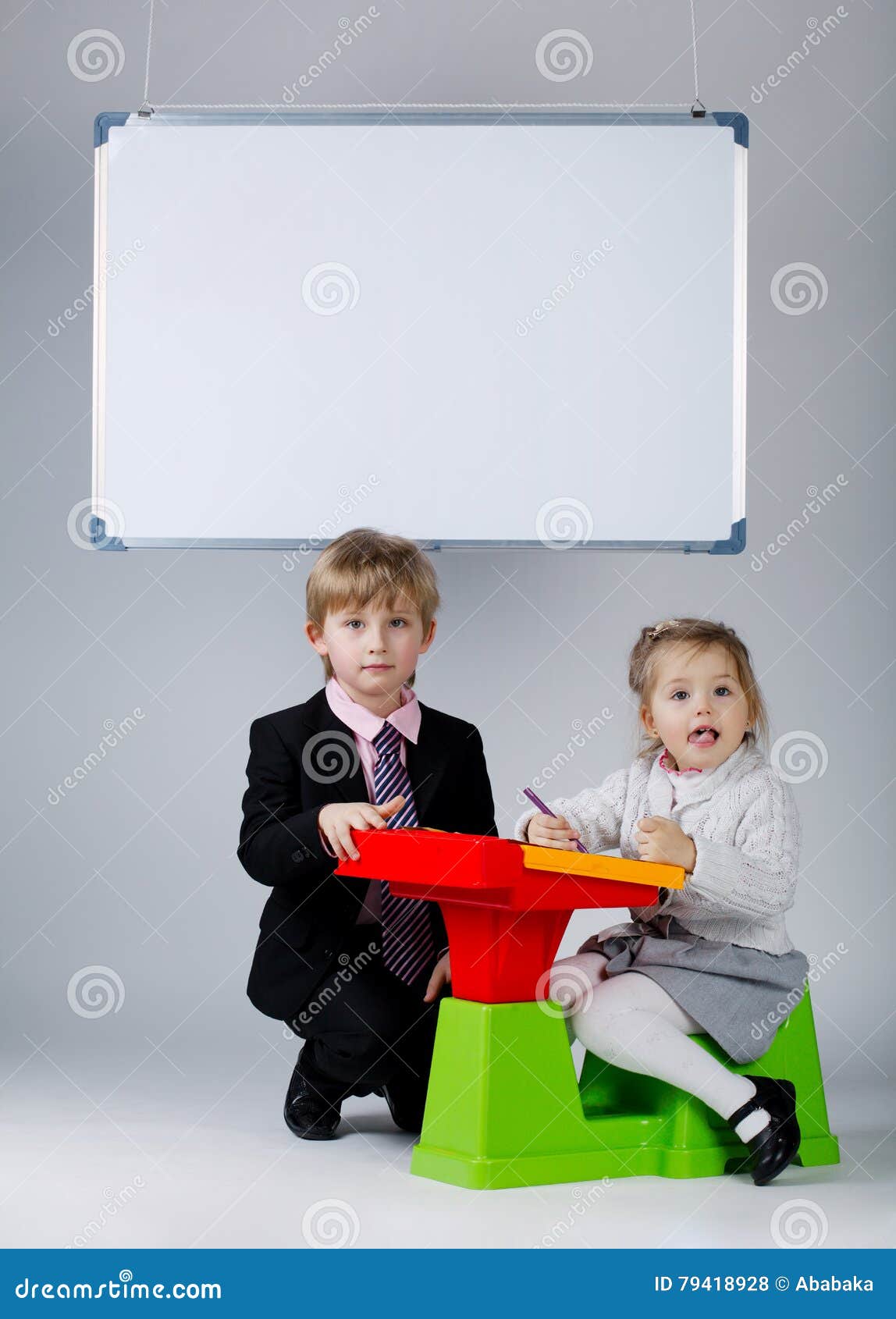 Young boy teaching sister stock photo. Image of cute - 79418928