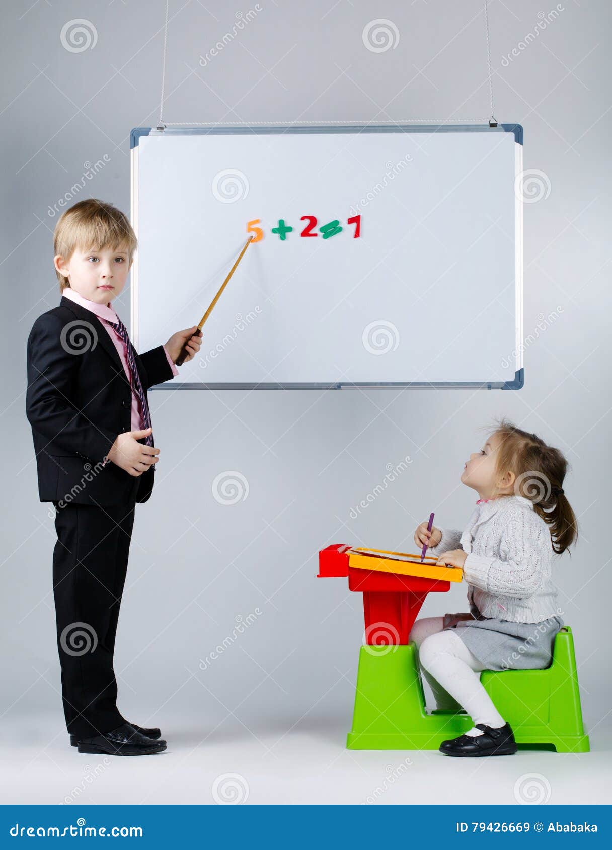 Young boy teaching sister stock image. Image of caucasian - 79426669