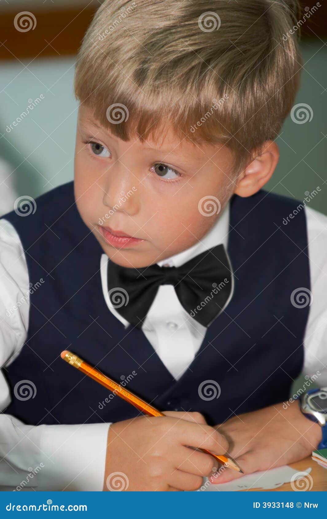 Young Boy Thinking in Classroom Stock Photo - Image of child, education ...