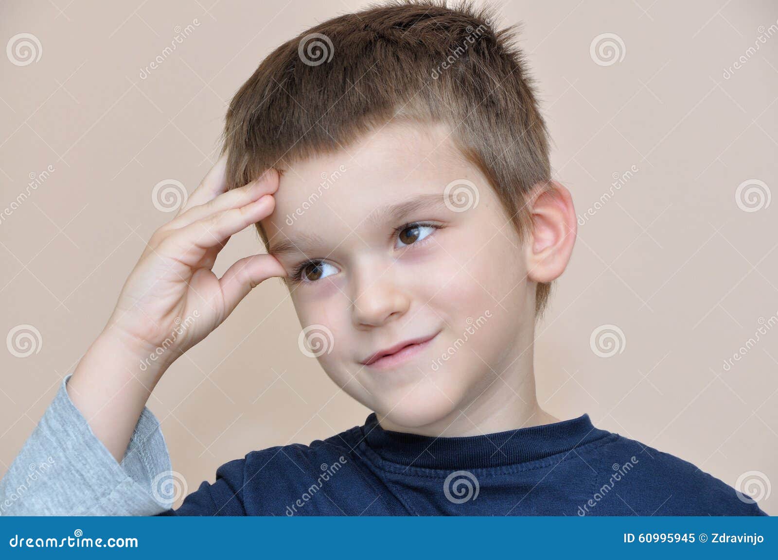 Young Boy Thinking and Holding Fingers on Head Stock Image - Image of ...
