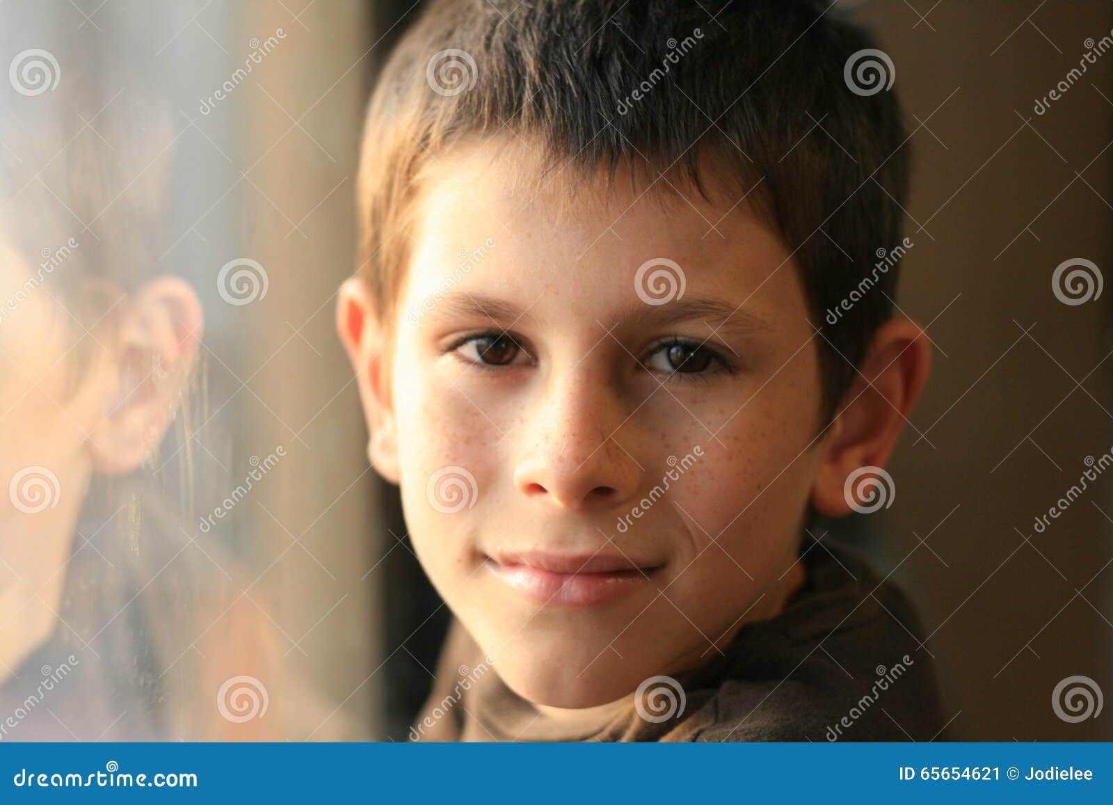 Young Boy in Thought with Window Reflection Stock Image - Image of ...