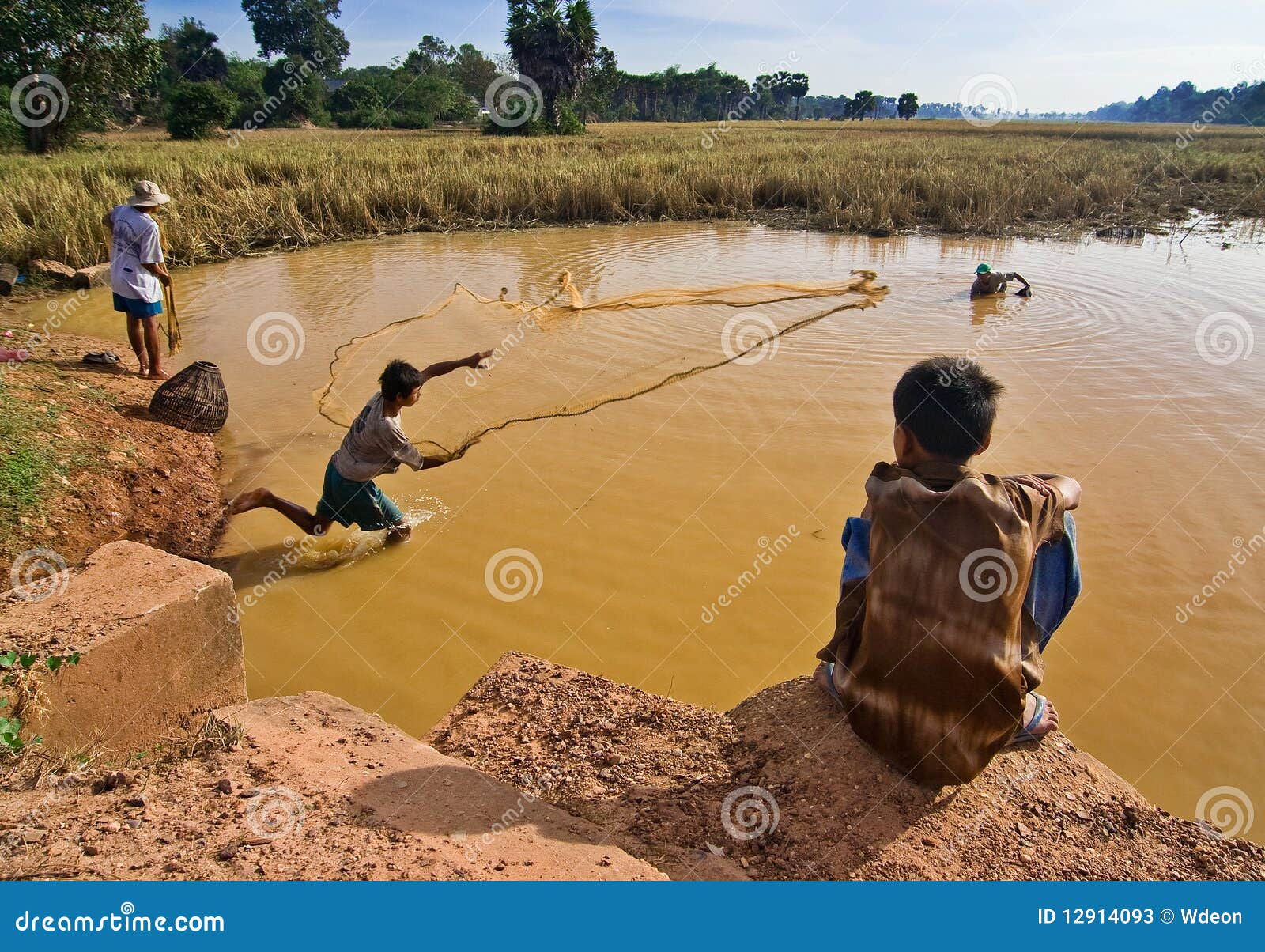A Young Boy Throws a Fishing Net Editorial Stock Photo - Image of body ...
