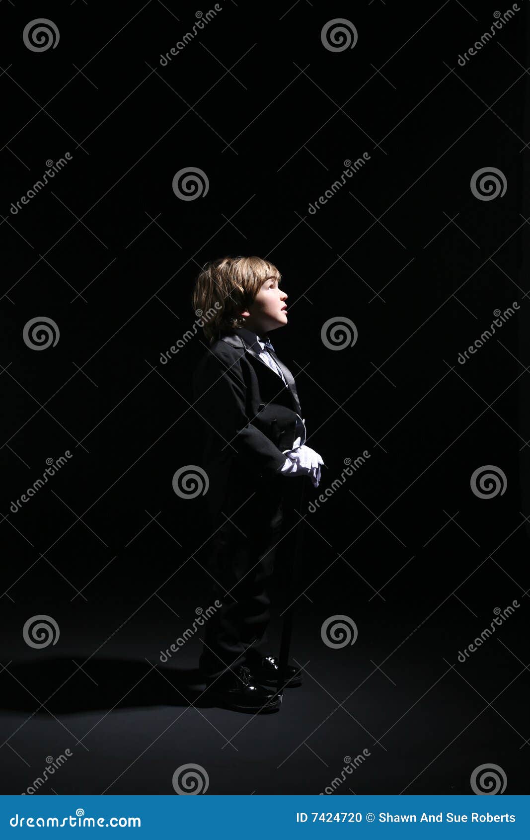 Young Boy in Tuxedo Looking Off To the Side Stock Photo - Image of cute ...