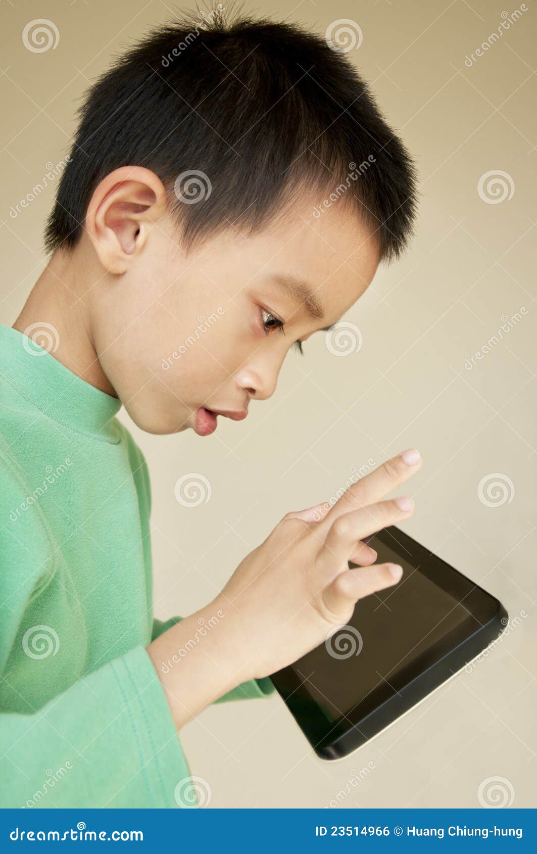 Young boy use to tablet pc stock photo. Image of focus - 23514966