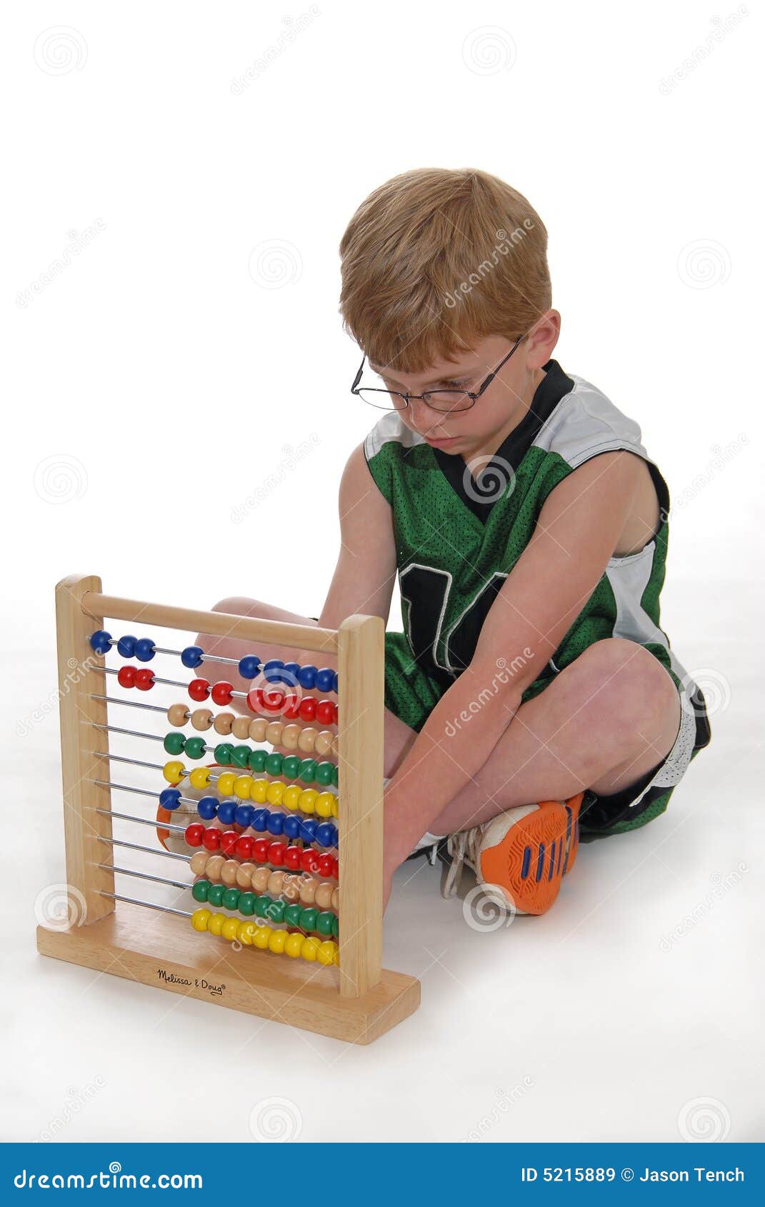 Young Boy Using Abacus Picture. Image: 5215889
