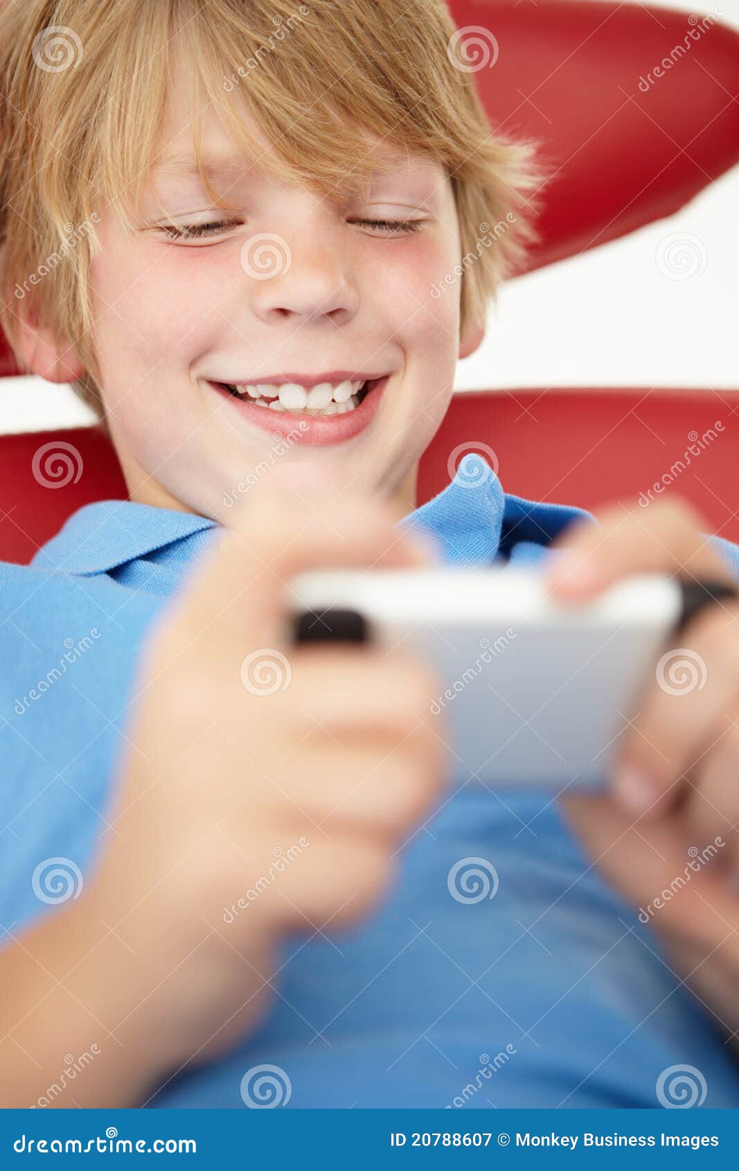 Young boy using cellphone stock image. Image of cell - 20788607