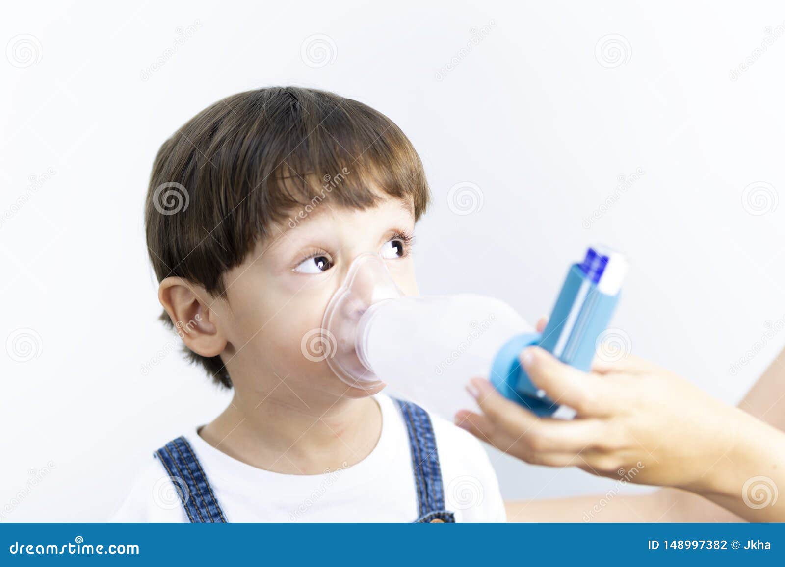 Young Boy Using Inhaler stock photo. Image of child - 148997382