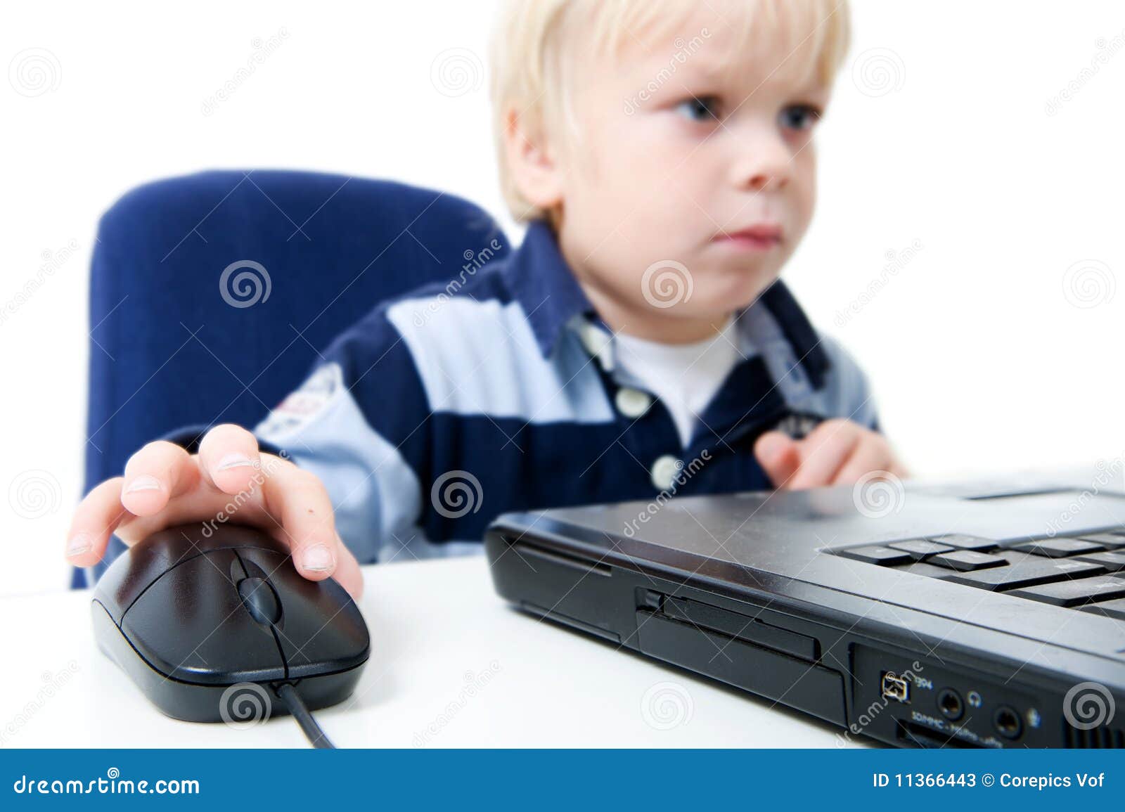 Young Boy Using Laptop stock image. Image of clothing - 11366443