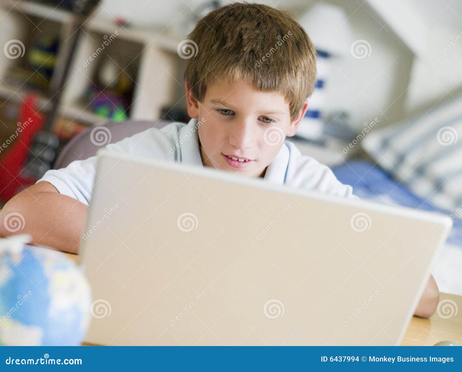 Young Boy Using Laptop in His Bedroom Stock Photo - Image of technology ...
