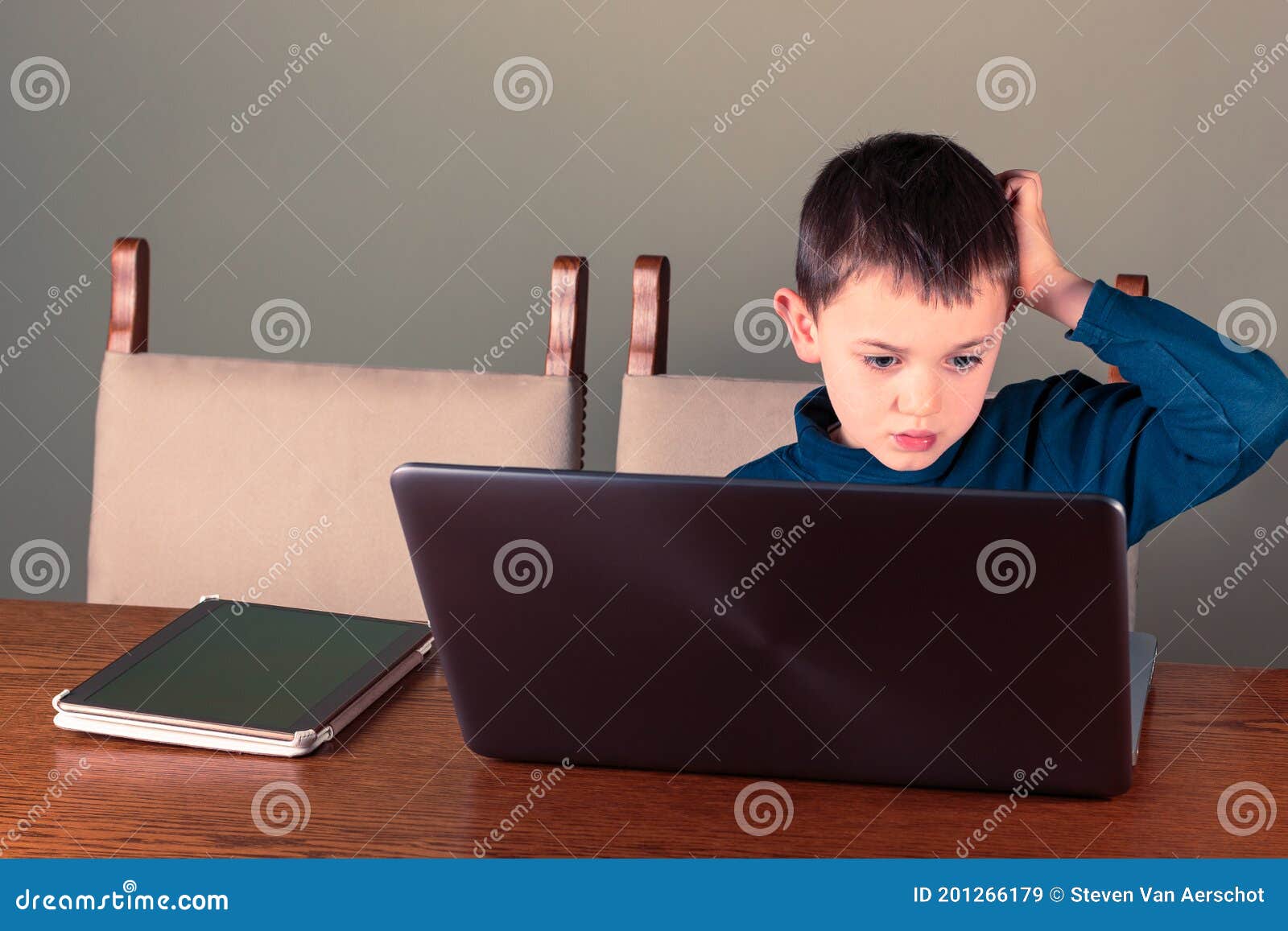 Young Boy Using a Laptop and Tablet Computer Stock Image - Image of ...