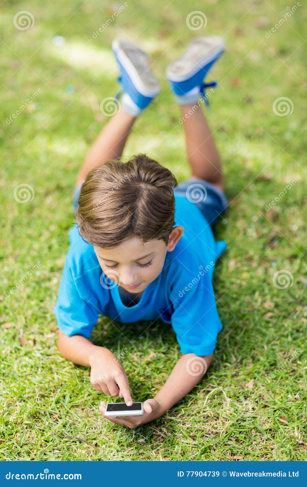 Young Boy Using Mobile Phone Stock Image - Image of countryside, male ...